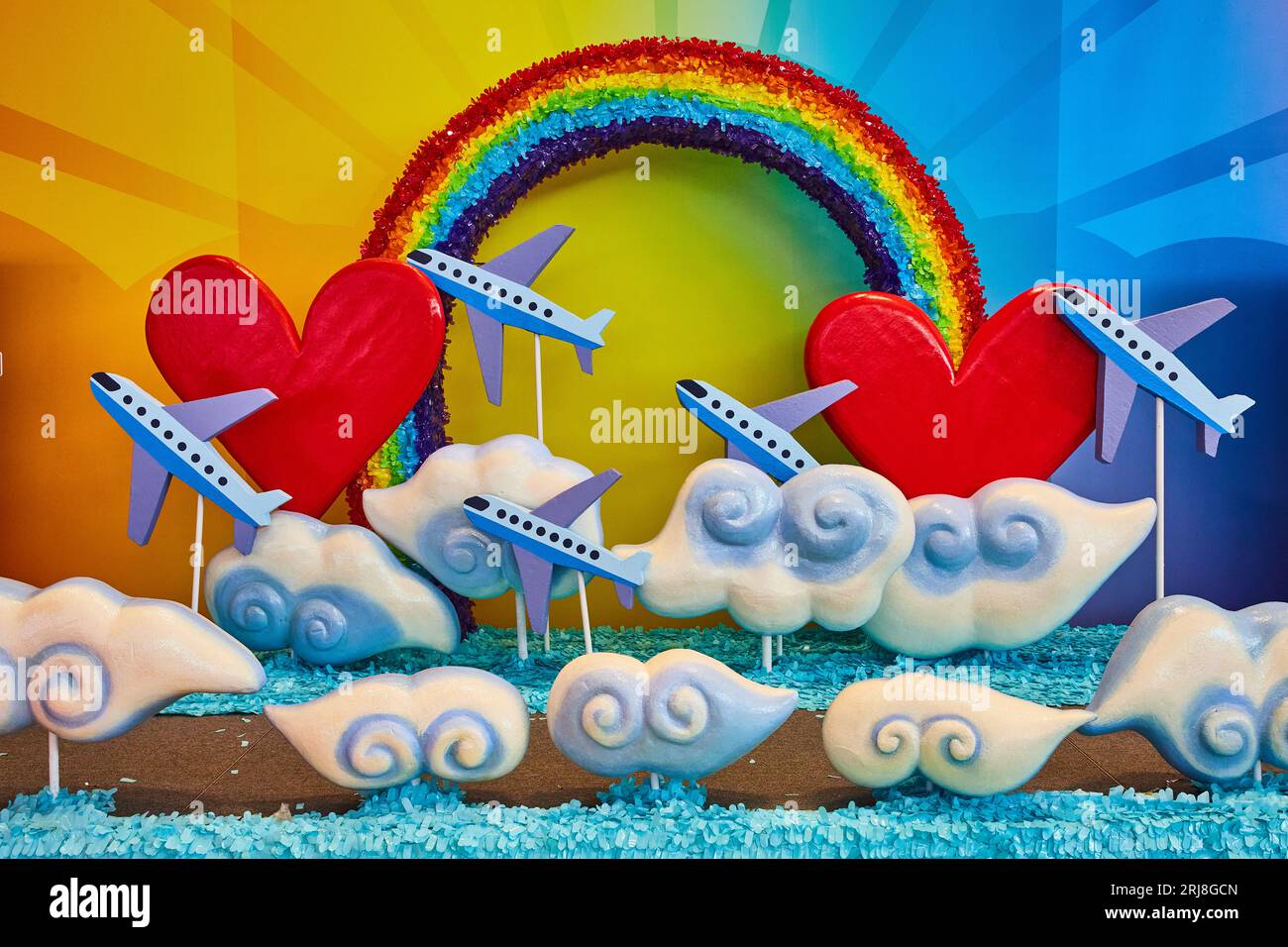 Diorama artwork of airplanes flying through clouds to a rainbow with ...