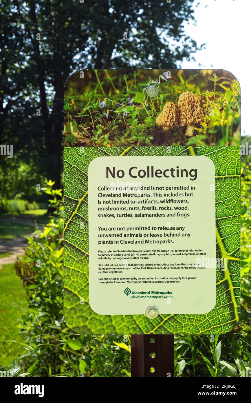 A trail-side sign in a Cleveland Metro park warns of unpermitted ...