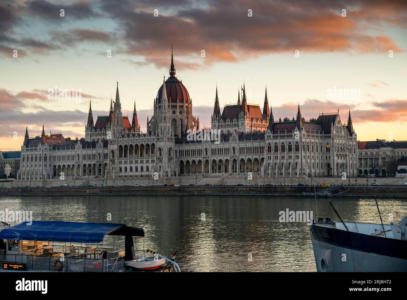 Gentle sunset over the Hungarian Parliament Building on the Danube ...