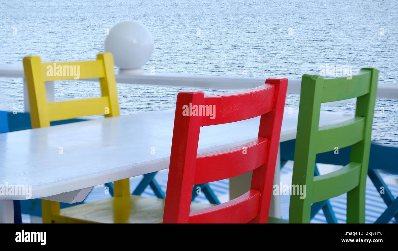 Colorful chairs in a seafood restaurant Stock Photo - Alamy