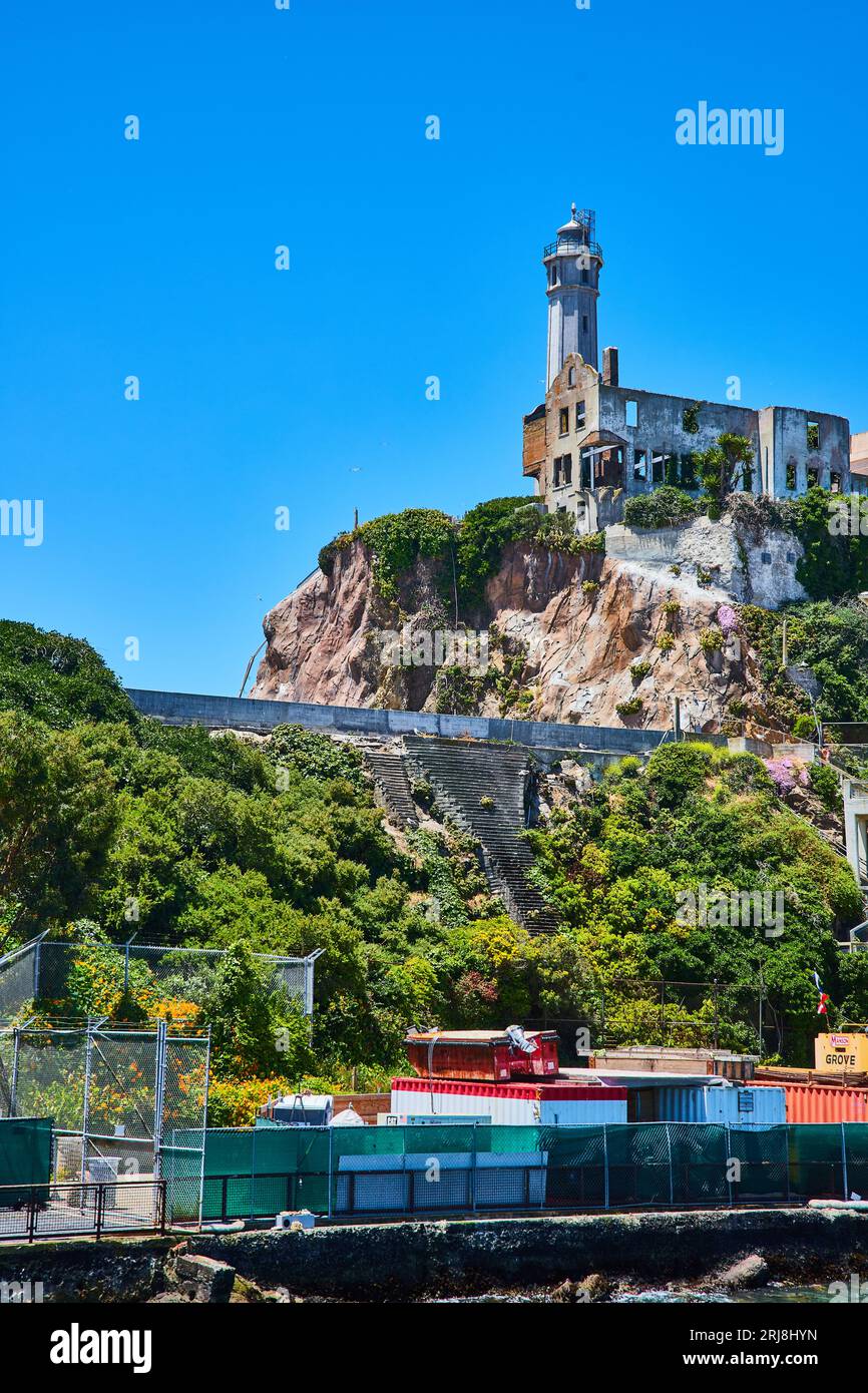 Bright blue sky overhead Alcatraz Island lighthouse with pier view of ...