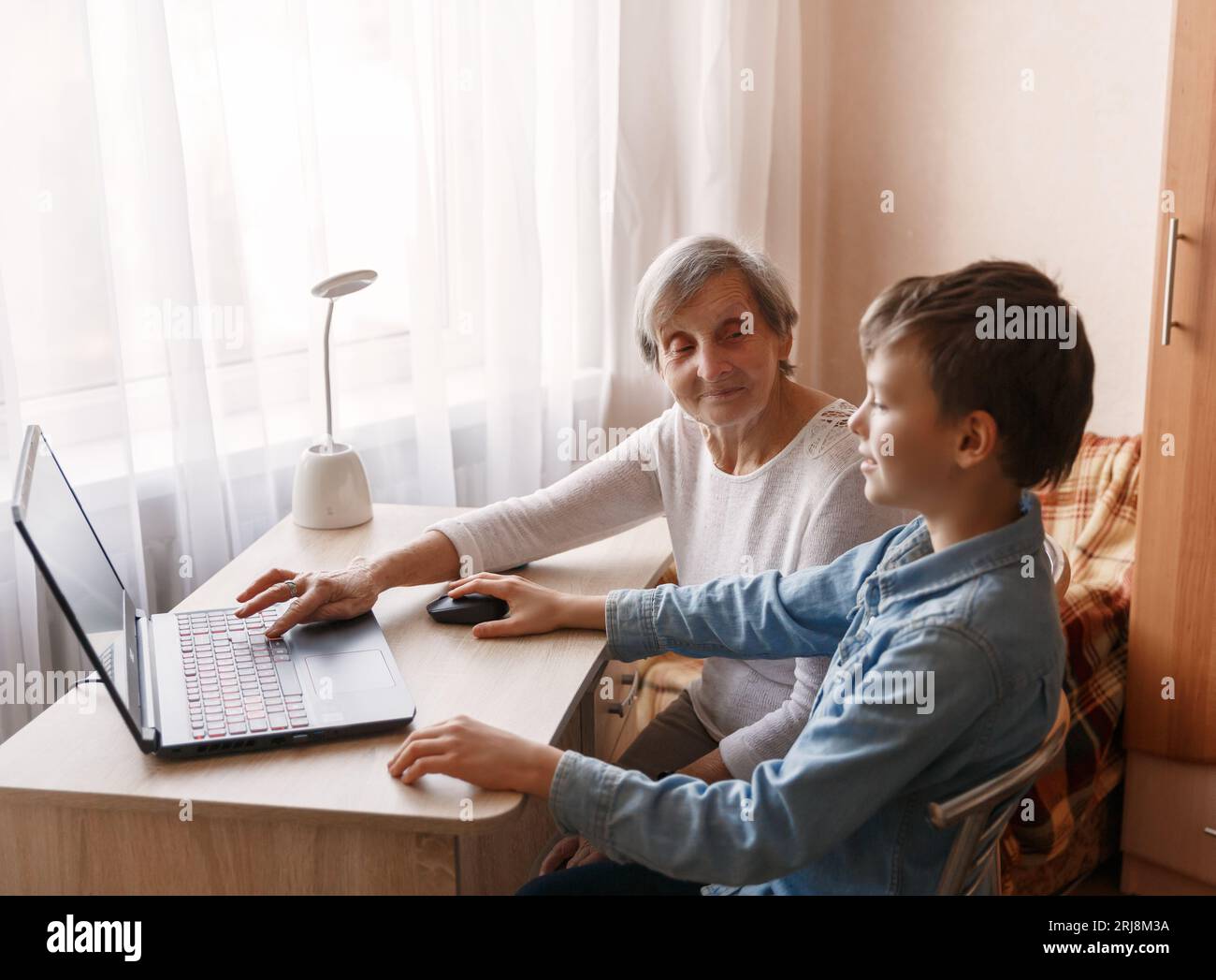 80s senior woman learning to use a laptop Stock Photo - Alamy