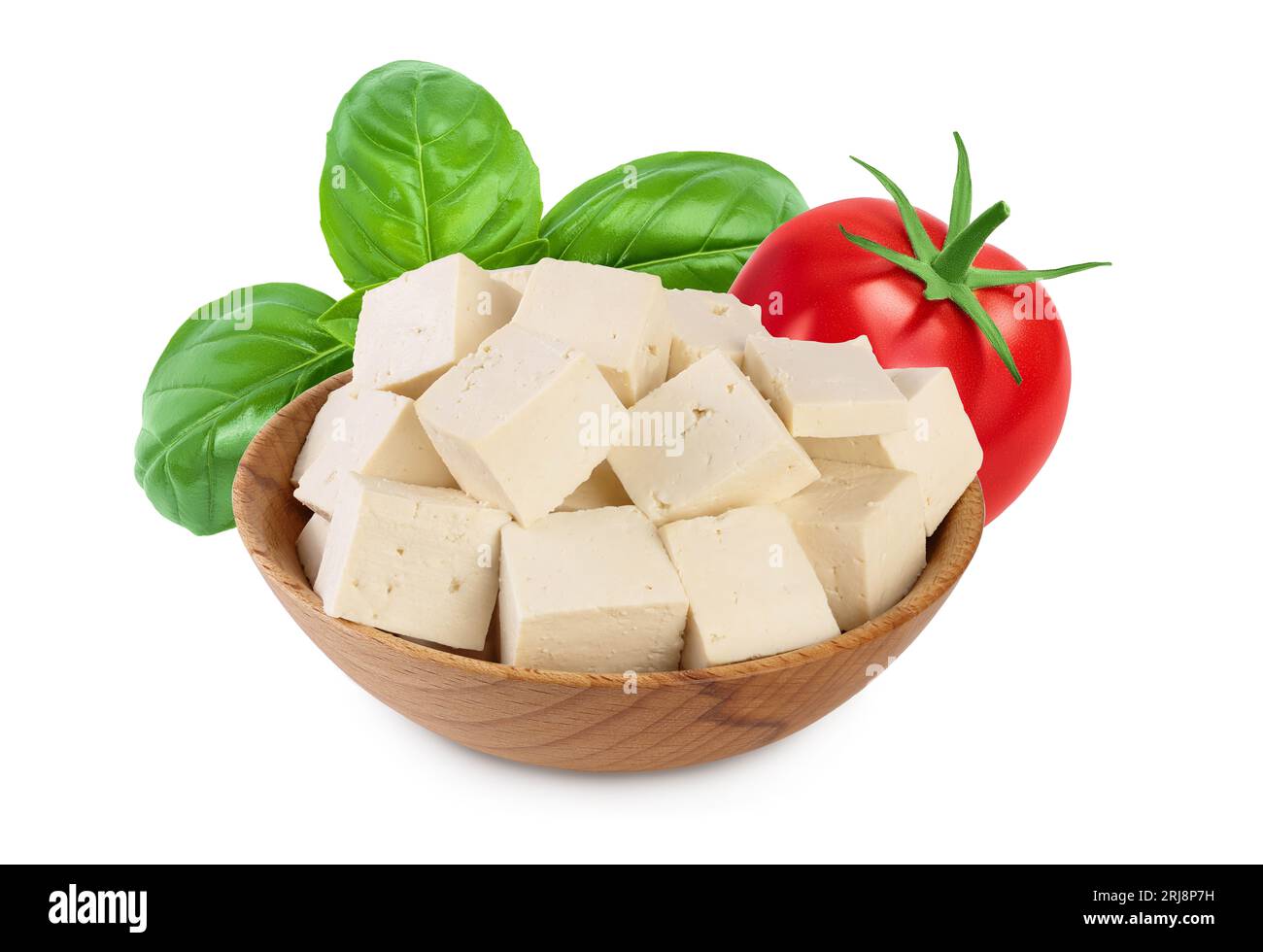 Heap of diced tofu cheese in wooden bowl isolated on white background ...