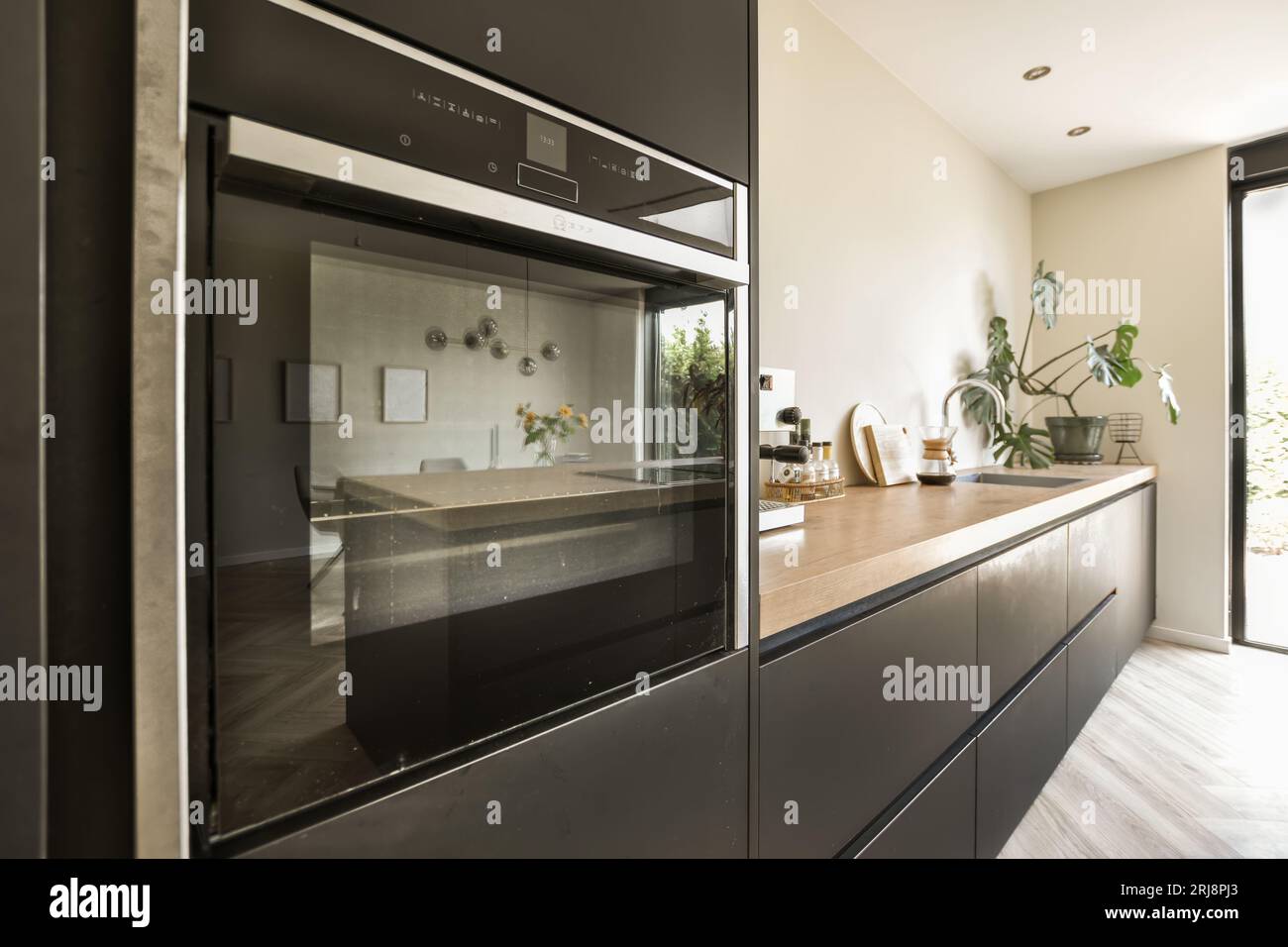 a modern kitchen with wood counter tops and stainless steel oven hoods ...