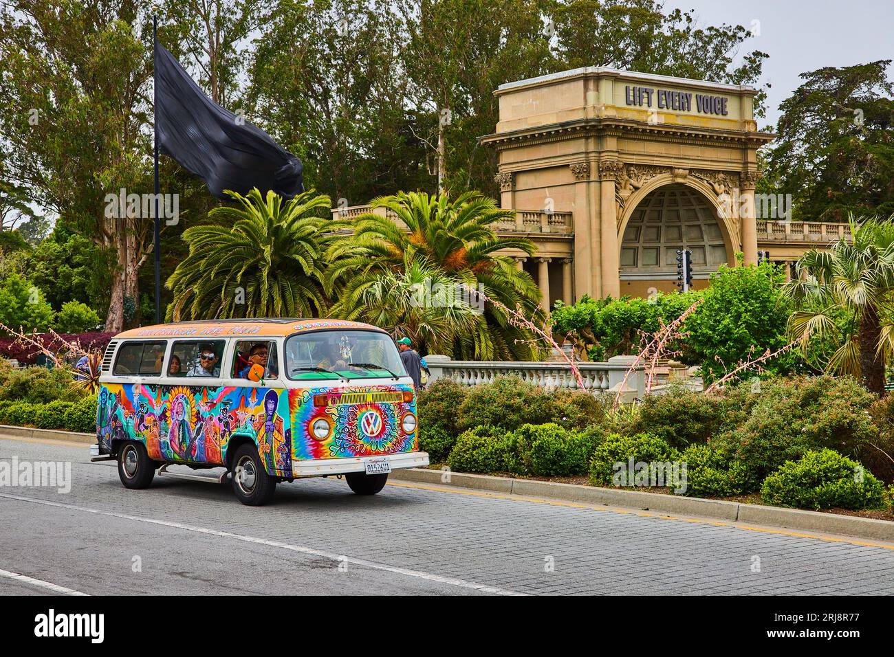 Hippy bus driving on road with Music Concourse building in background ...