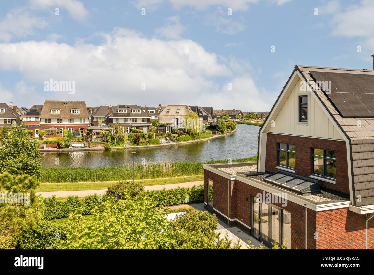 some houses by the water with trees and buildings in the foregrounds on ...