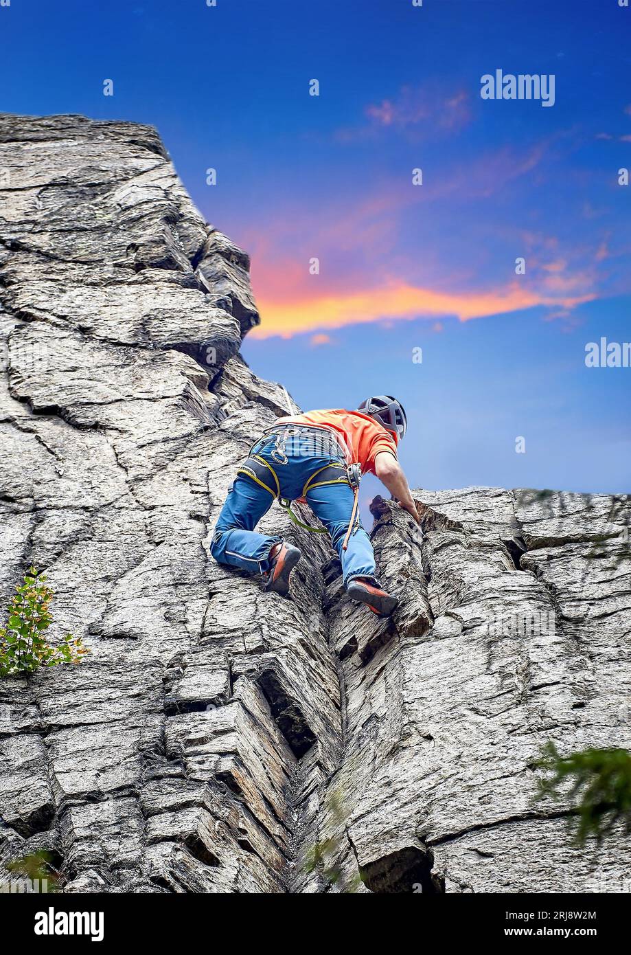 The rock climber reaching the top Stock Photo - Alamy