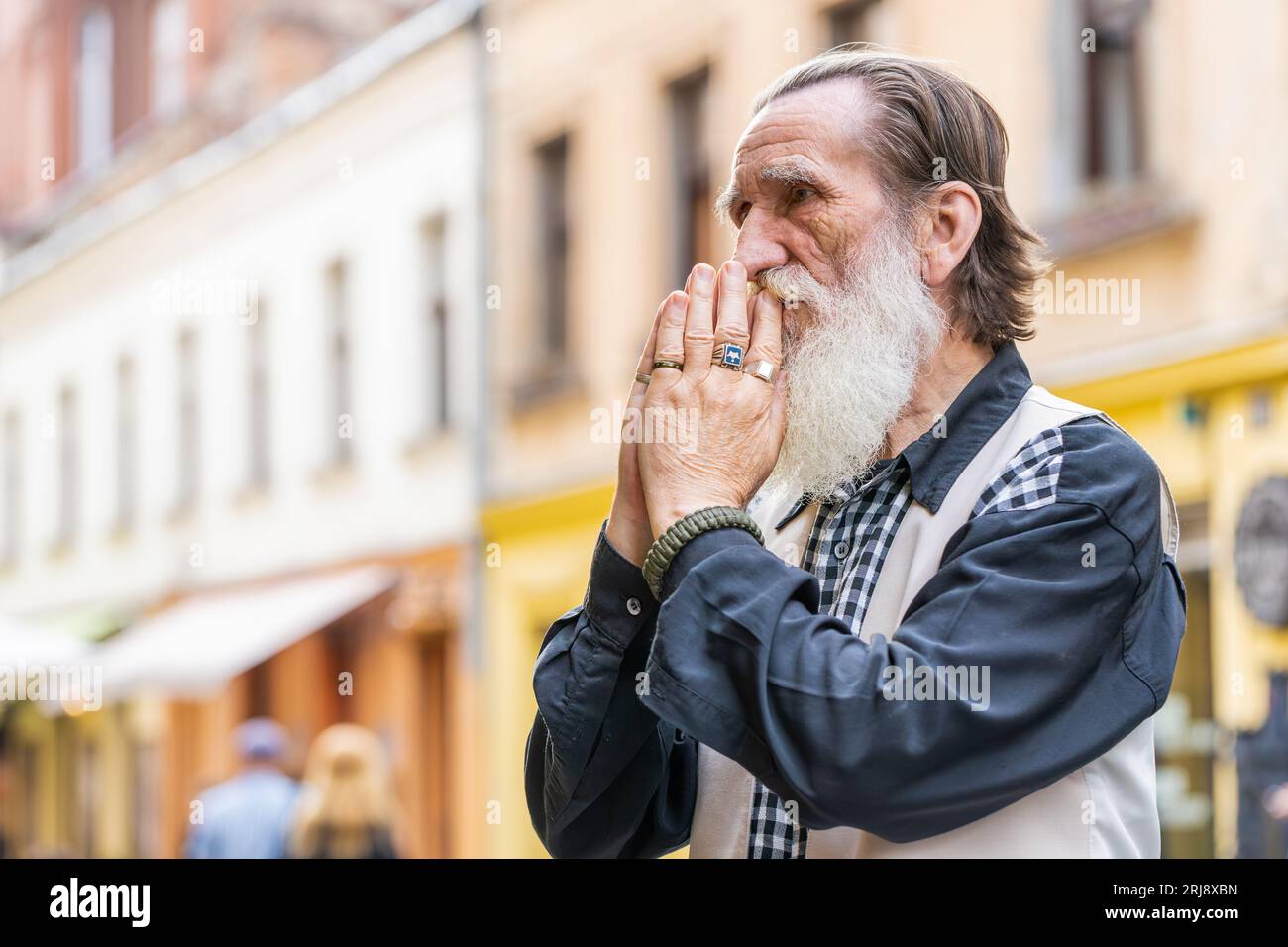 Portrait of bearded religion senior man praying with closed eyes to God ...