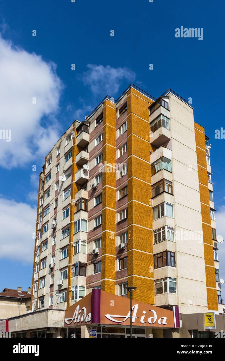 An aerial view of a bustling urban neighborhood, featuring a large ...