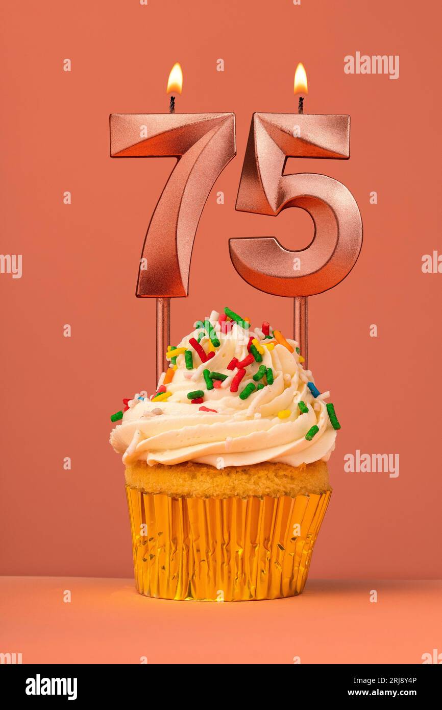 Birthday cake with candle number 75 - Coral fusion background Stock ...