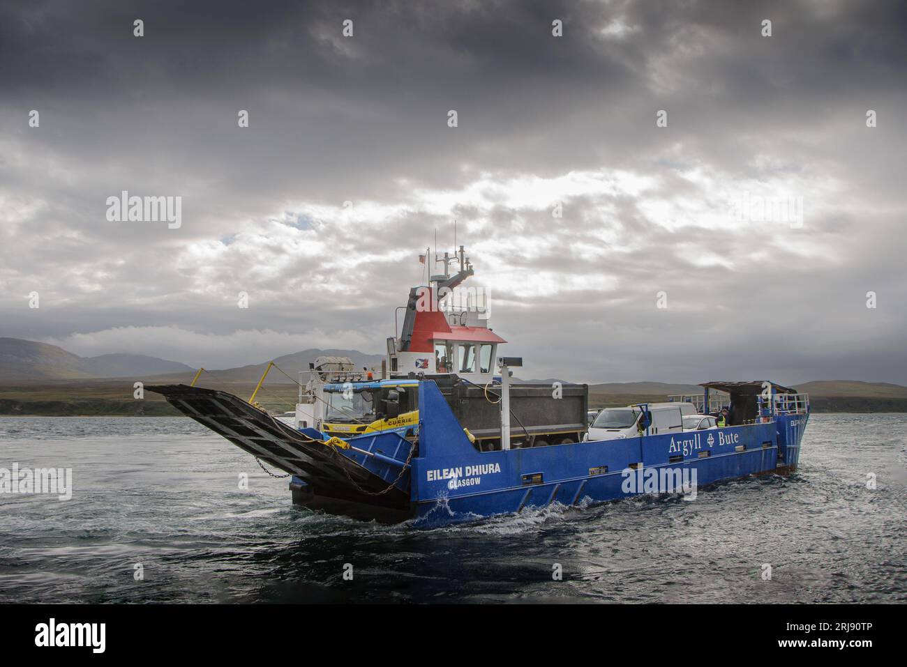 The small vehicle ferry from Port Askaig on the Isle of Islay to Feolin ...