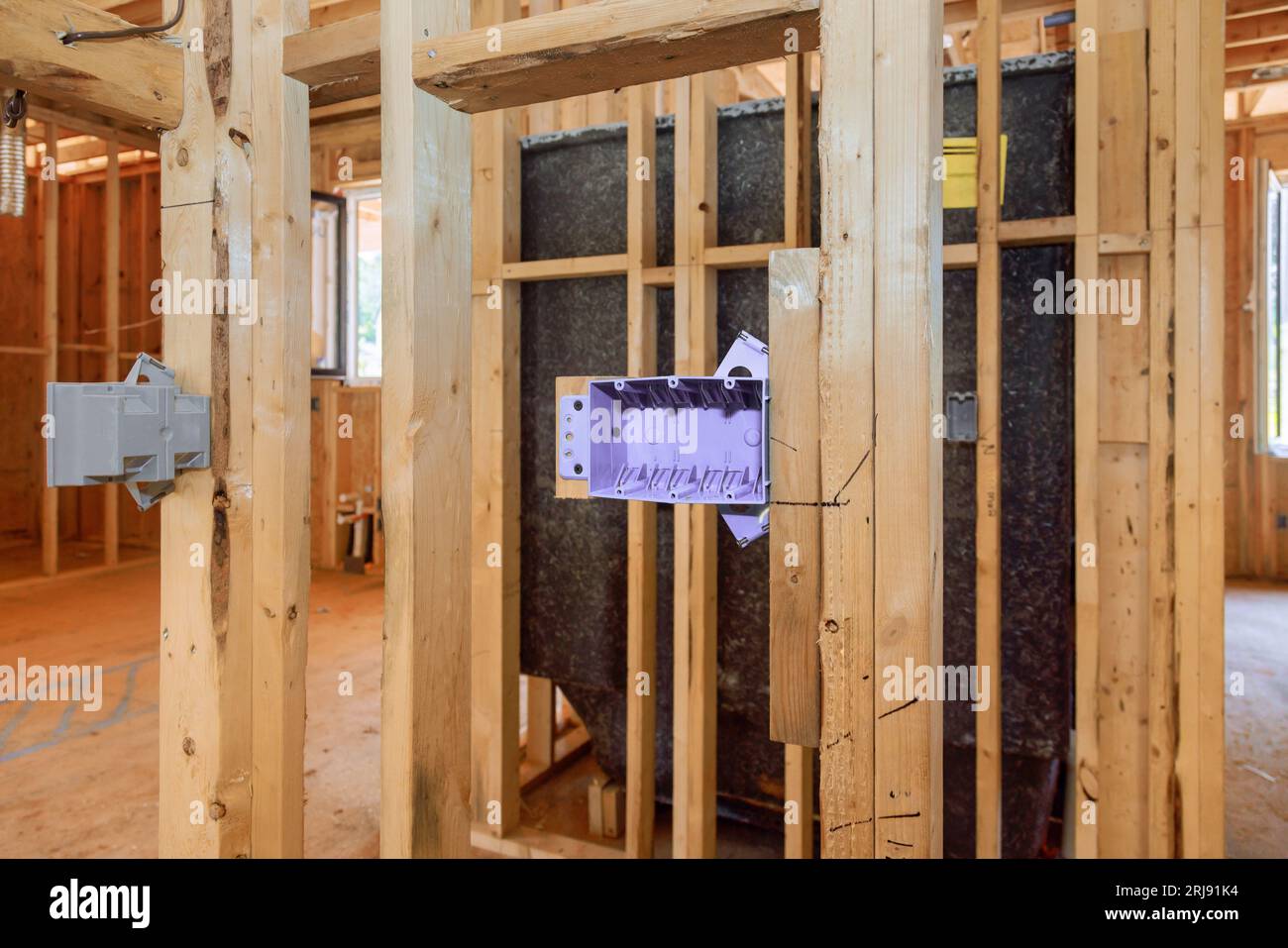 New home construction interior work of installing electrical box wiring Stock Photo - Alamy