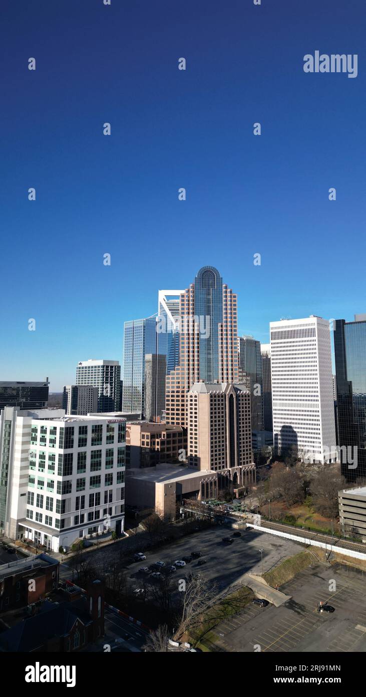 An aerial view of a bustling metropolitan cityscape, featuring a vibrant skyline of tall ...
