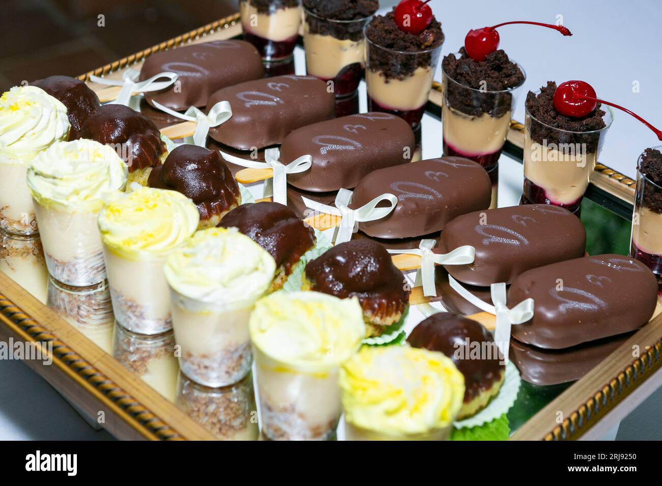 Social events; Individual Dessert Table For Guests Stock Photo - Alamy