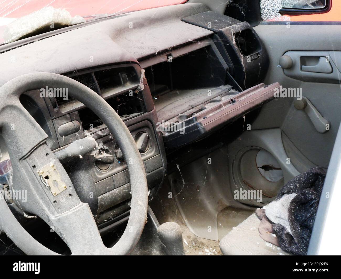 A close up of the interior of a desolated weathered vehicle, featuring ...