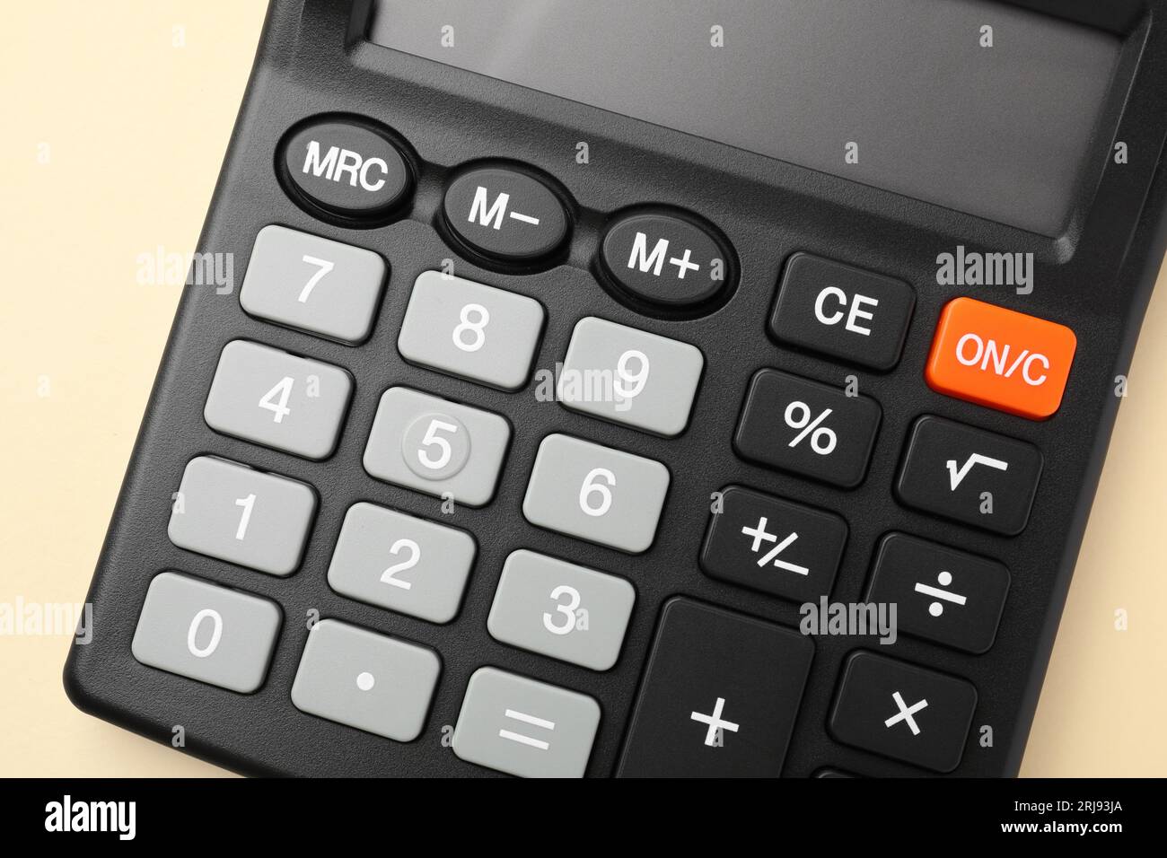 Calculator on beige background, top view. Office equipment Stock Photo ...