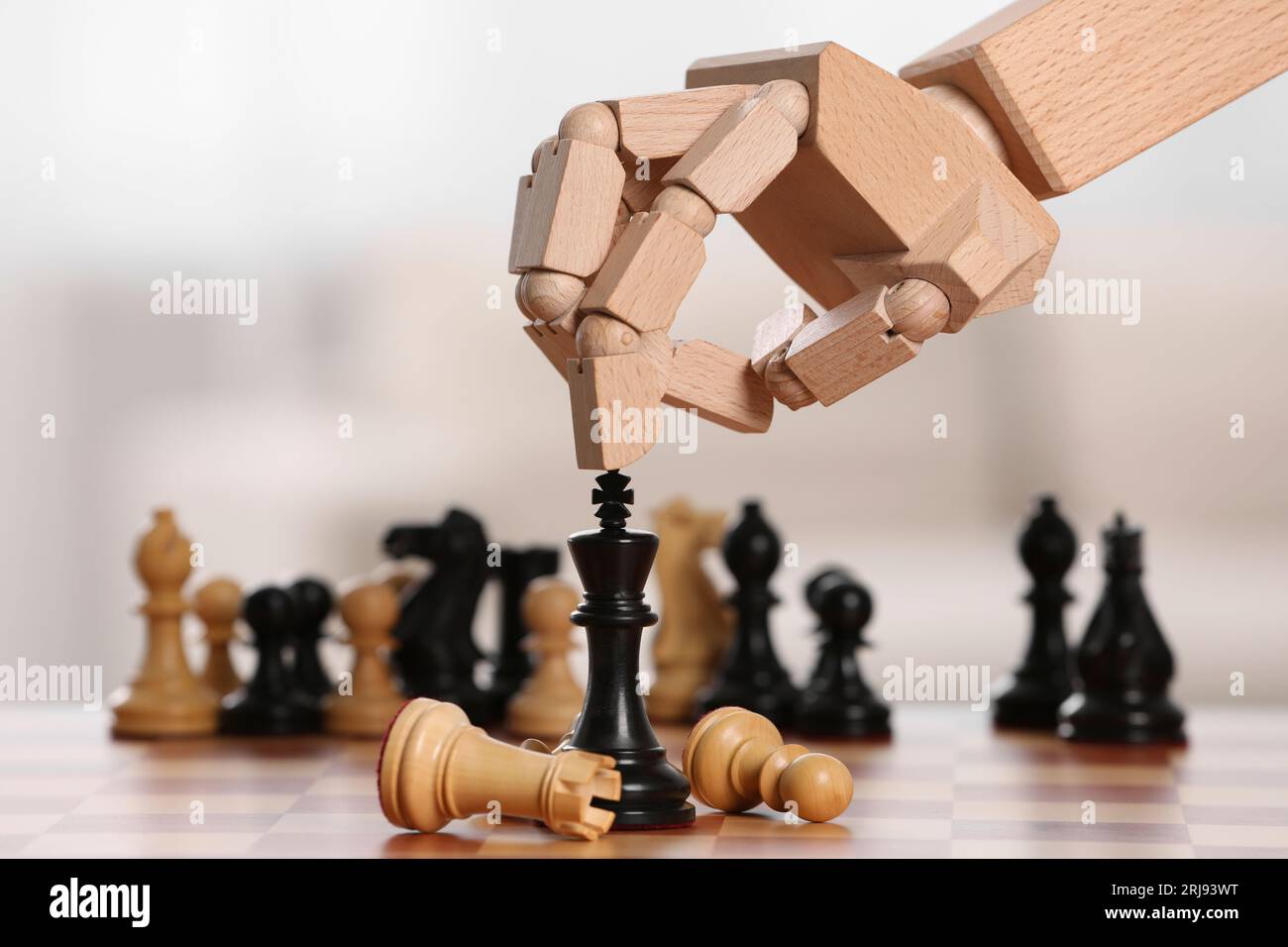 Robot playing chess, closeup. Wooden hand representing artificial ...