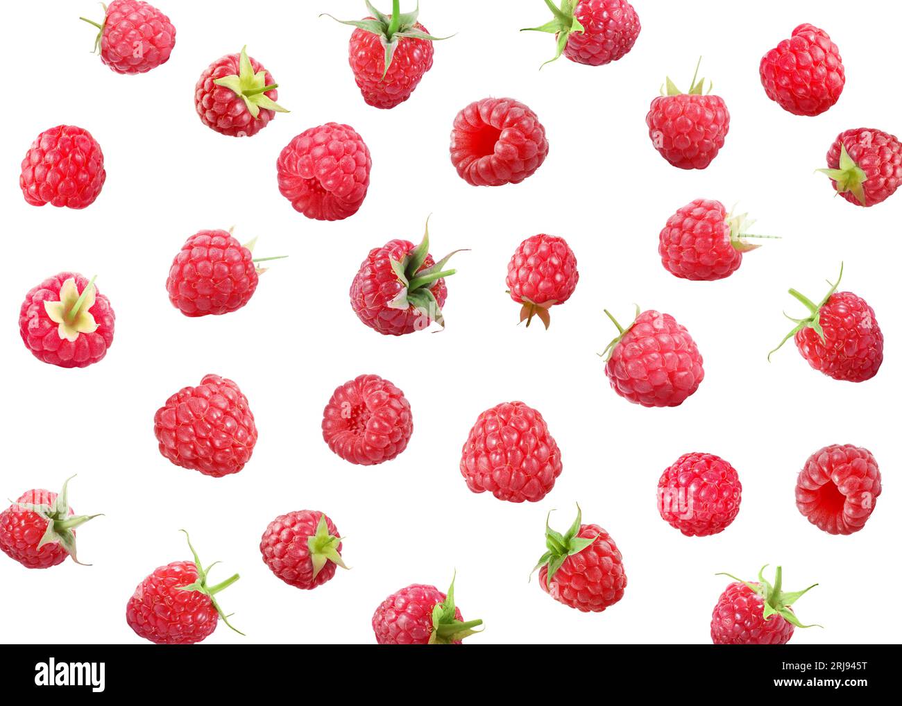 Many fresh ripe raspberries falling on white background Stock Photo - Alamy