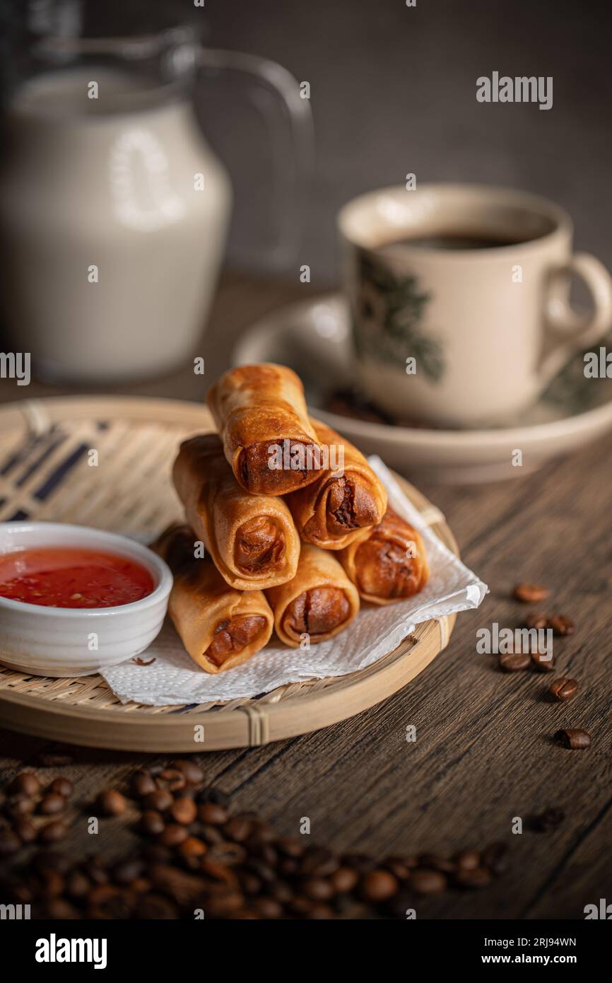Fried Spring Rolls on a Rattan Plate with a Sweet Chilli Sauce and a ...