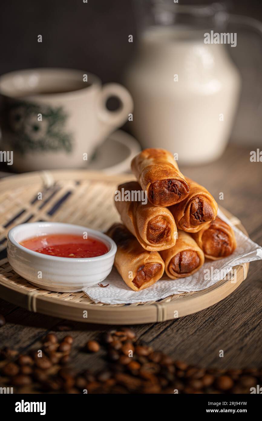 Fried Spring Rolls with a Sweet Chili Sauce on a Rattan Plate ...