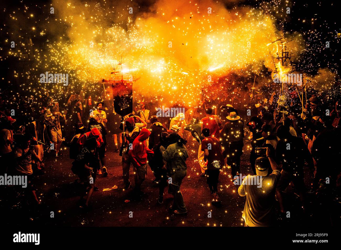 Barcelona, Spain. 21st Aug, 2023. Fire runners in devil costumes dance ...