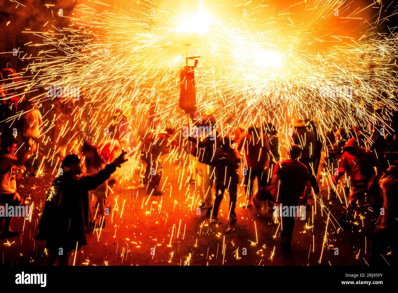 Barcelona, Spain. 21st Aug, 2023. Fire runners in devil costumes dance ...
