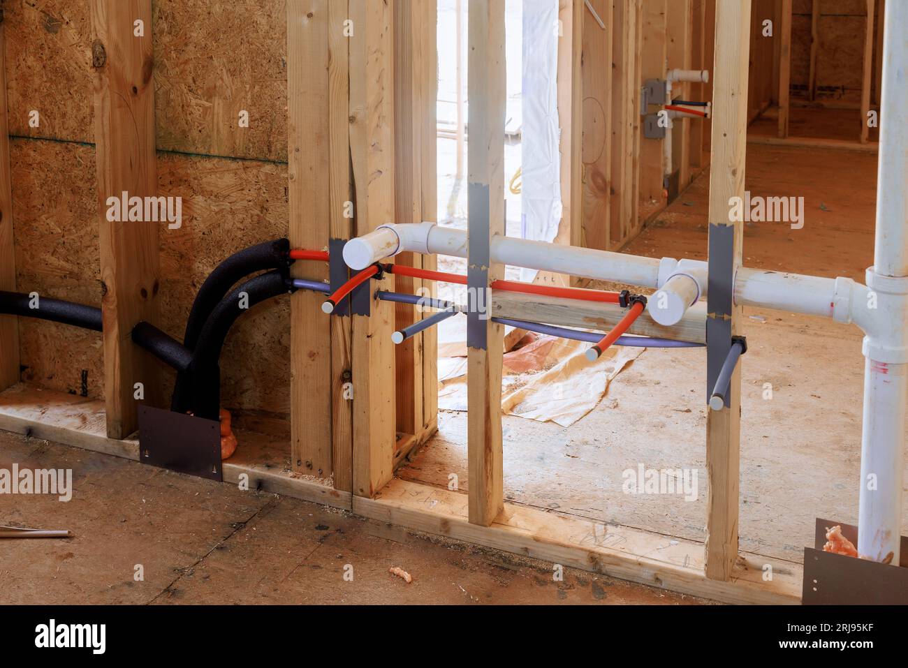 New home under construction rough plumbing featuring pvc waste a water ...