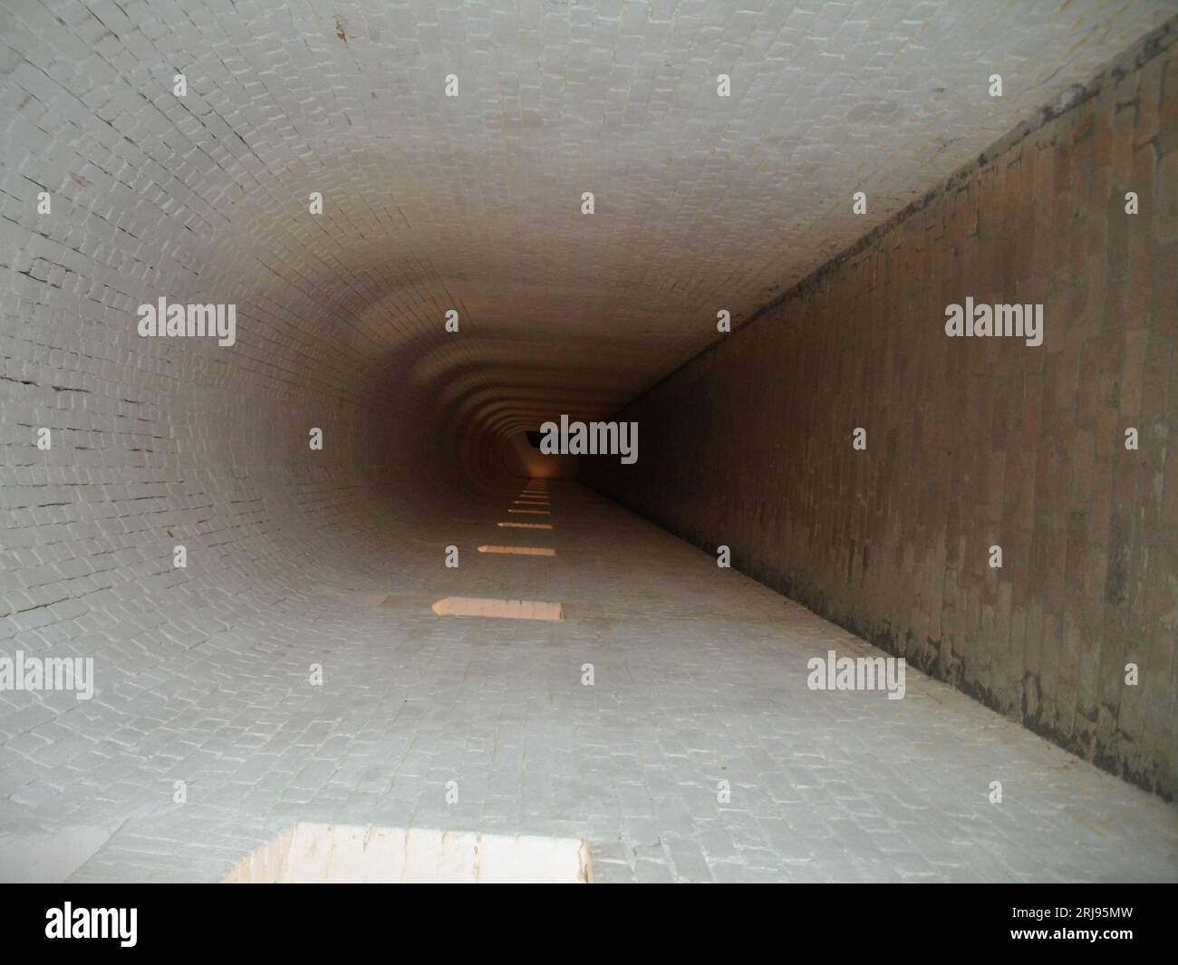 Endless history unfolds in Fort Barrancas' corridor. Sunlit arches ...