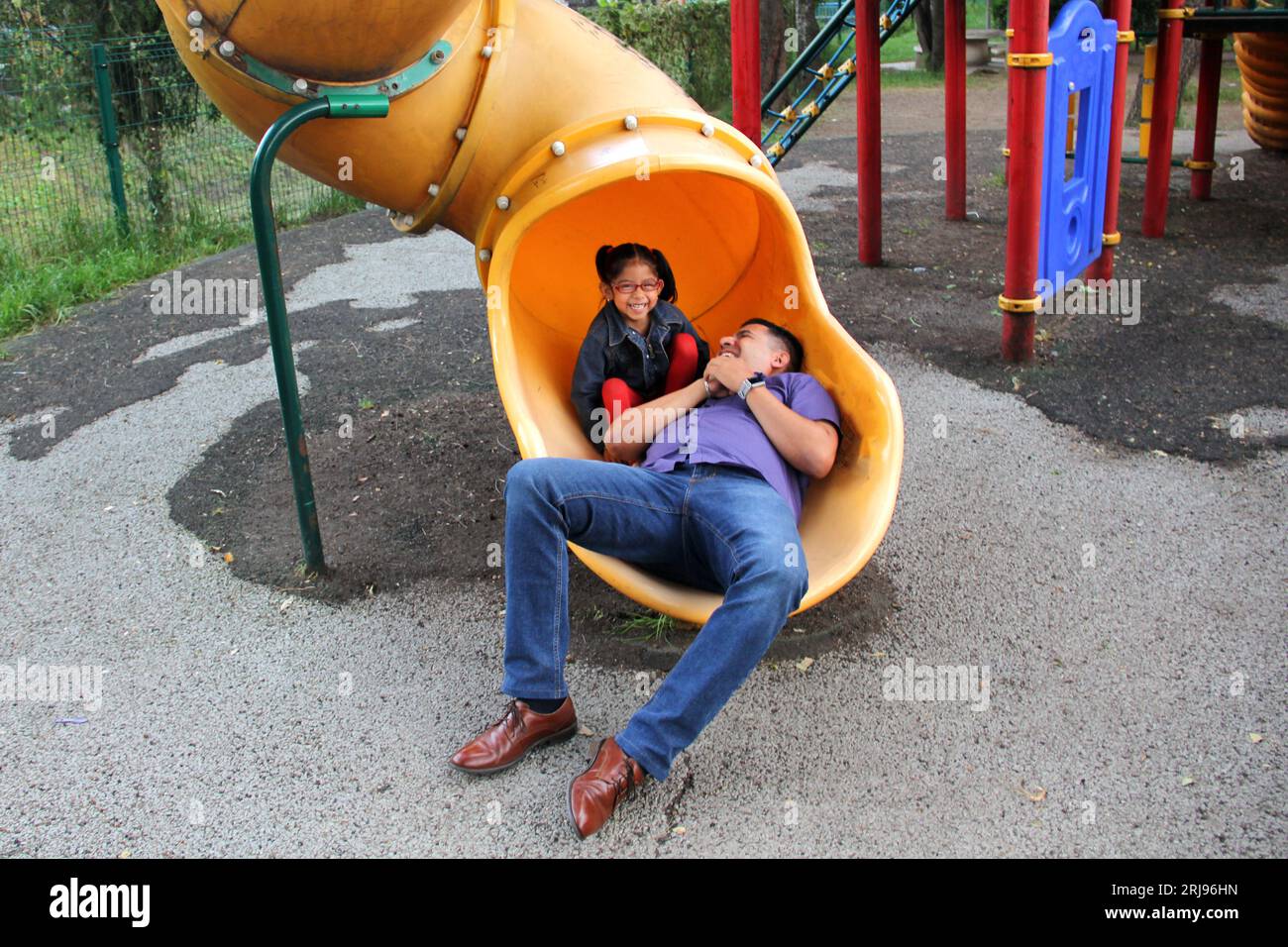 Divorced single dad with his brunette Latina daughter play in the park ...