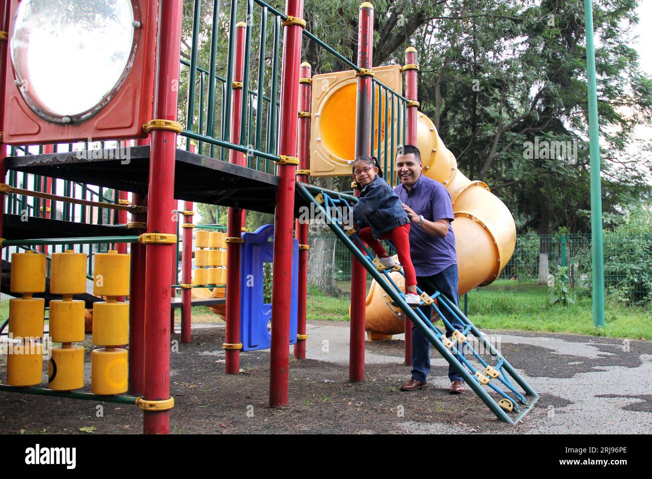 Divorced single dad with his brunette Latina daughter play in the park ...