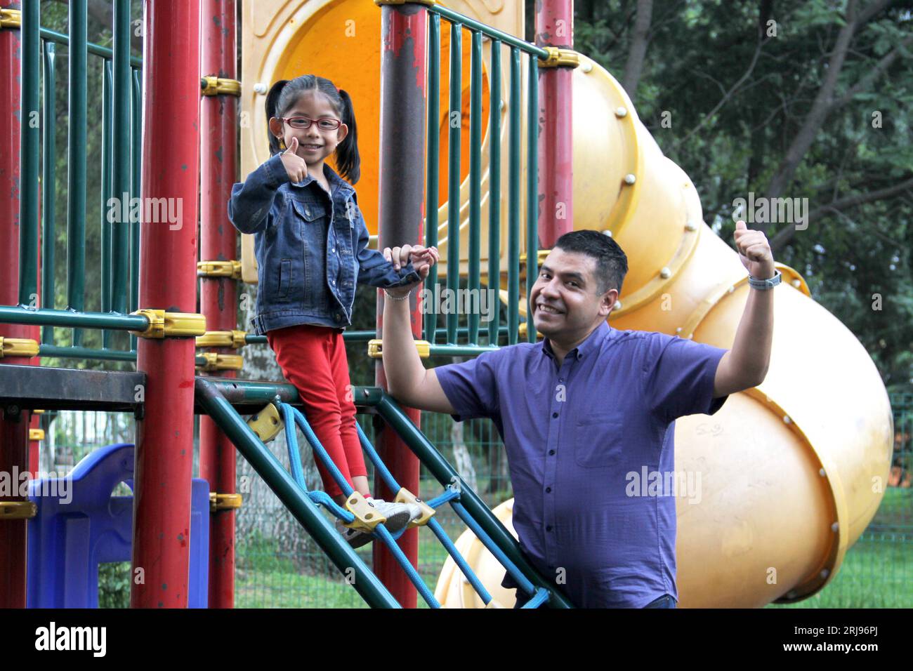 Divorced single dad with his brunette Latina daughter play in the park ...