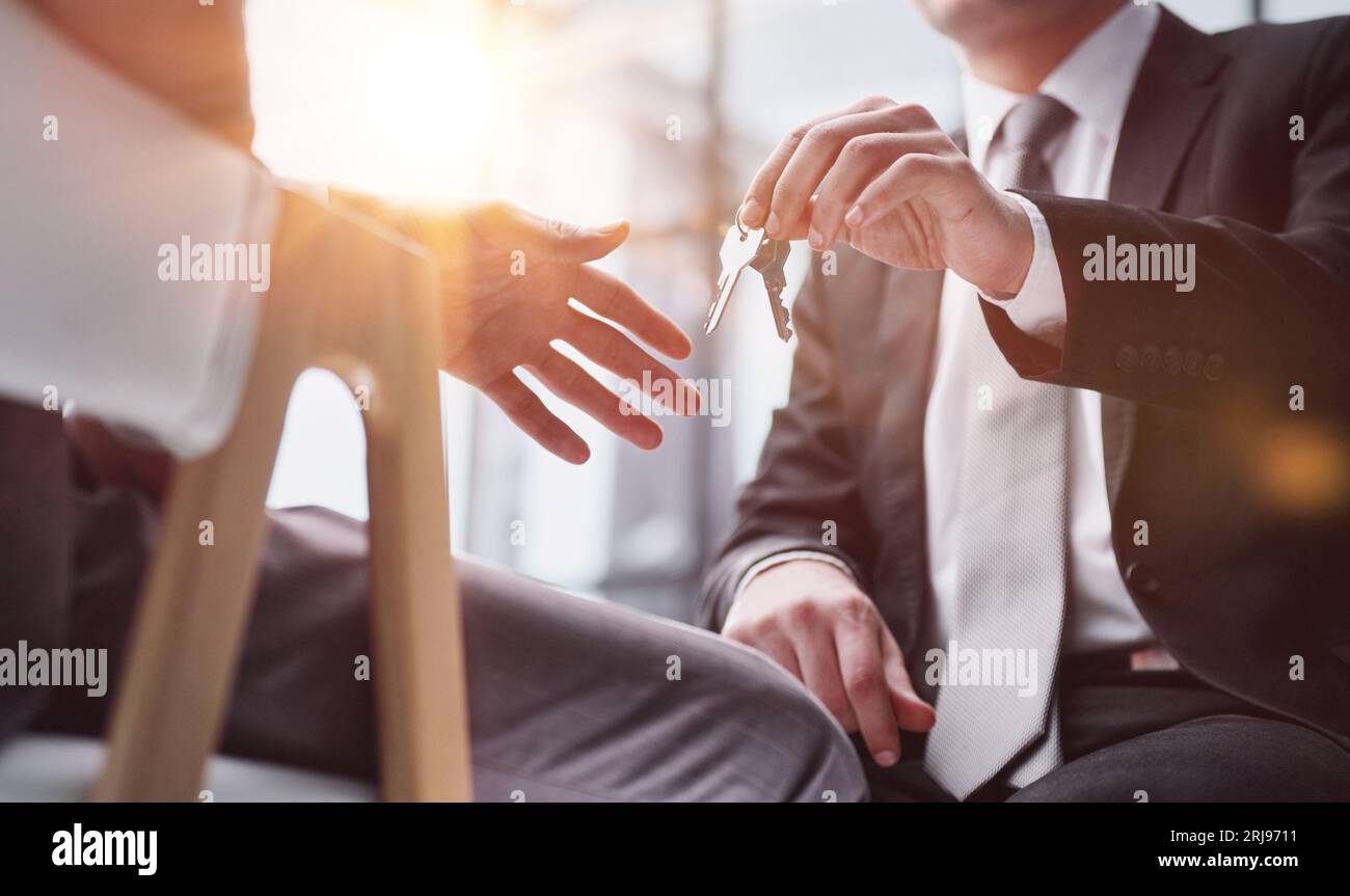 New property owner receiving the keys to his property Stock Photo - Alamy