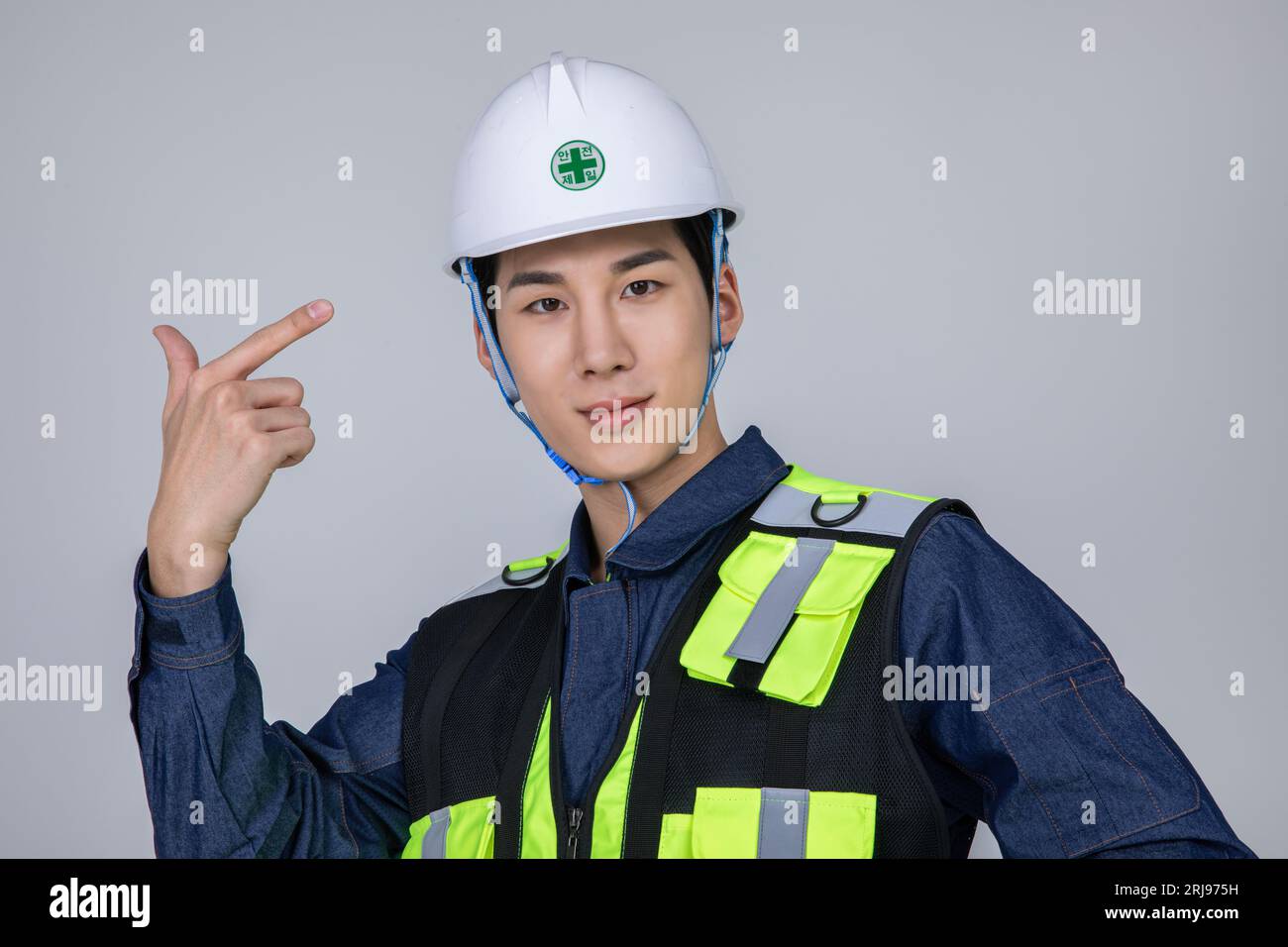 millennials and gen z, korean asian young man, site staff pointing a ...