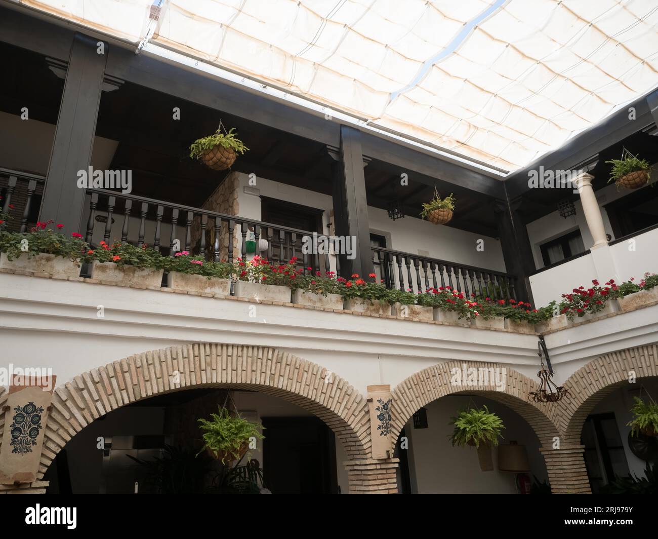A traditional Andalusian patio with colorful flowers Stock Photo - Alamy