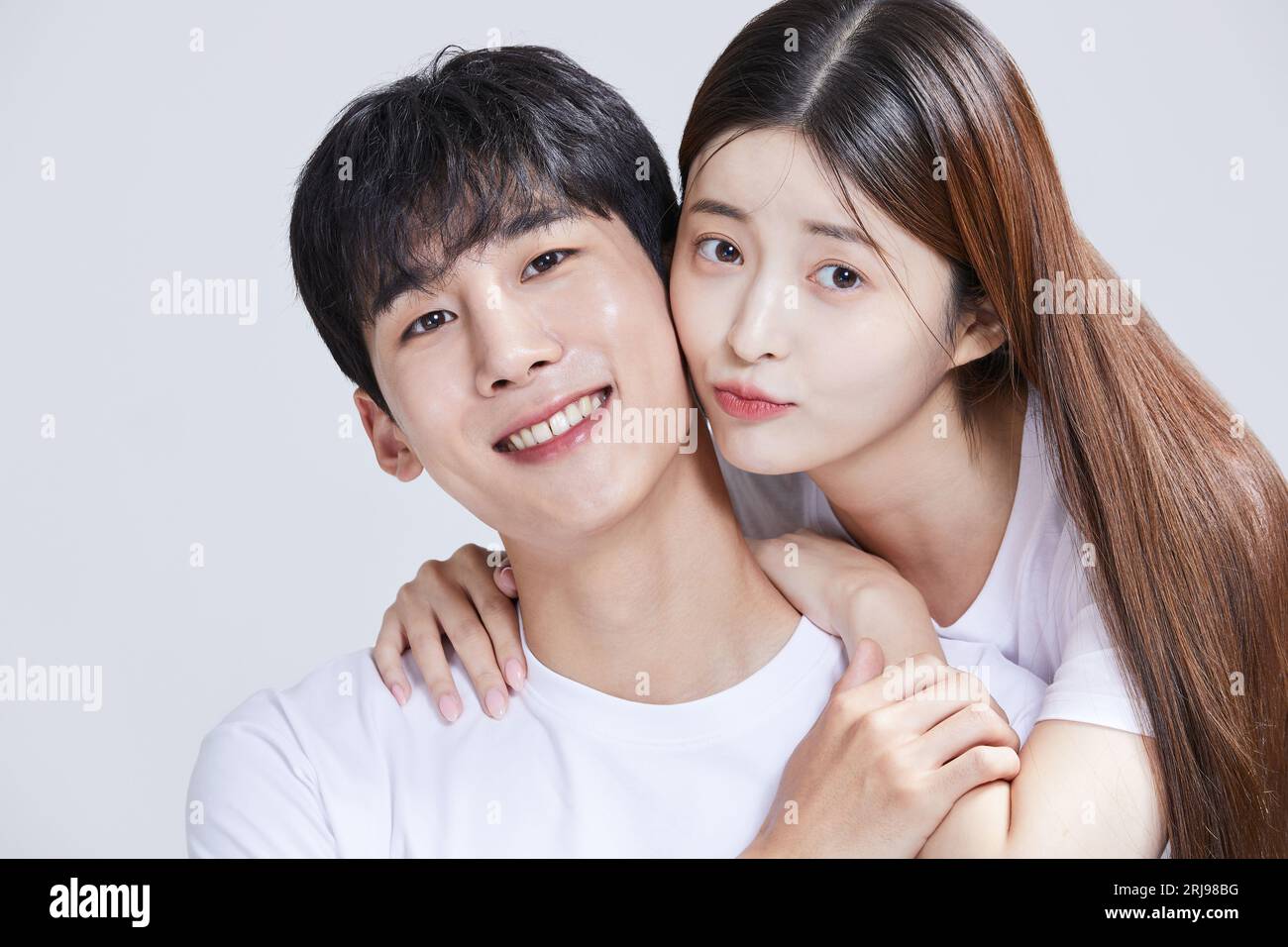 korean asian young couple putting their cheeks together Stock Photo - Alamy