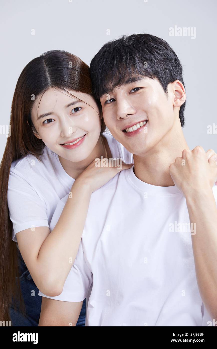 korean asian young couple putting their cheeks together Stock Photo - Alamy