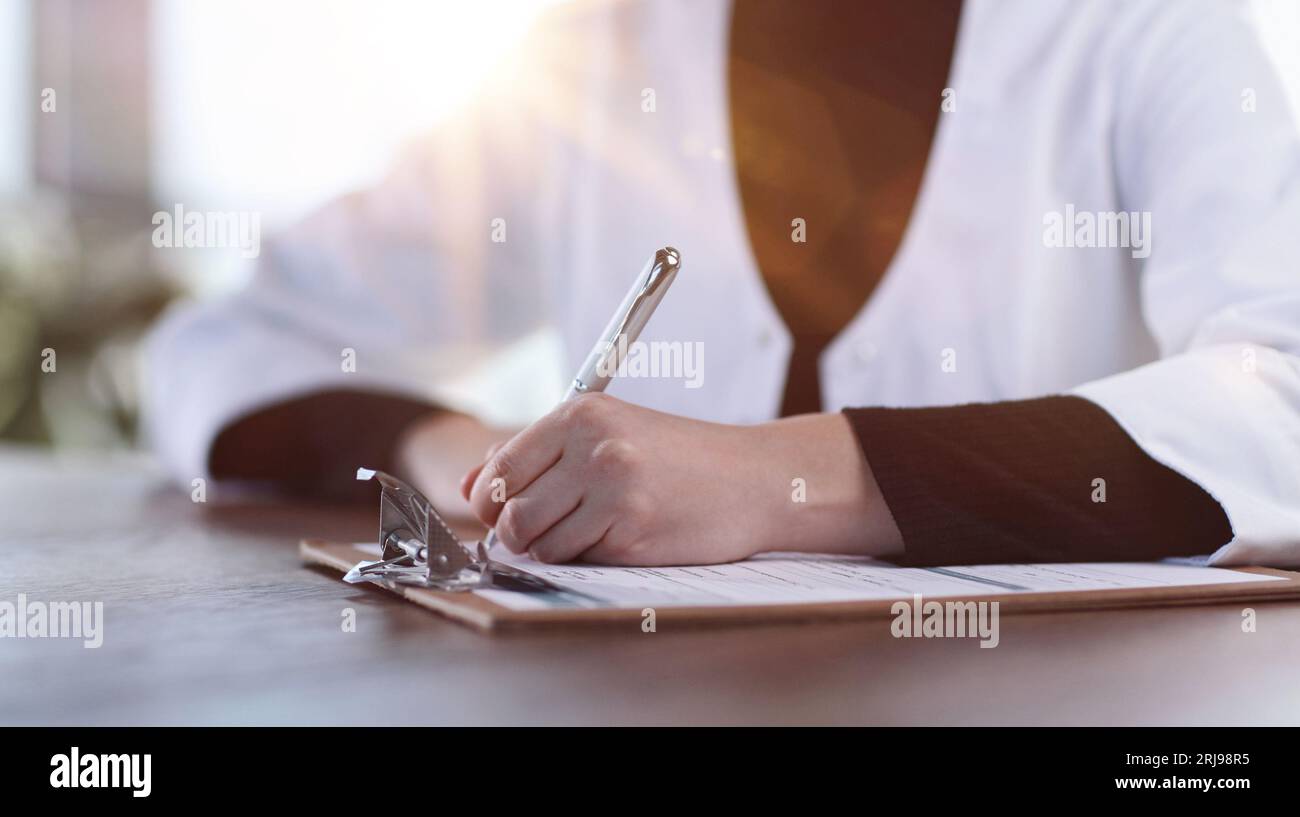 Female professional doctor hand making notes in medical journal Stock ...