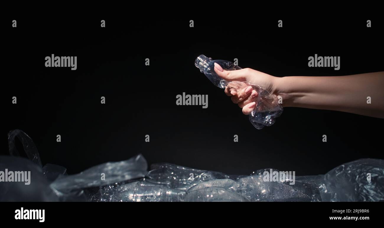 Waste reduction plastic woman hand used bottle Stock Photo - Alamy