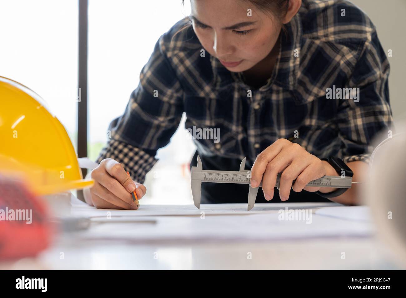 architect working with blueprints, engineer inspection in workplace for ...
