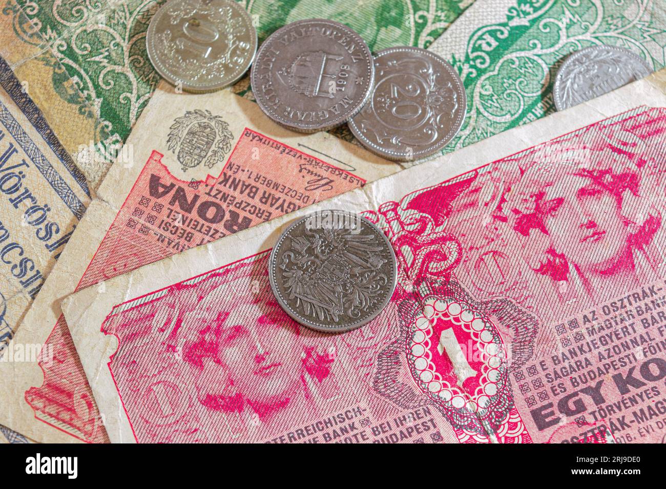 A closeup of Austrian and Hungarian coins from the early 1900s ...
