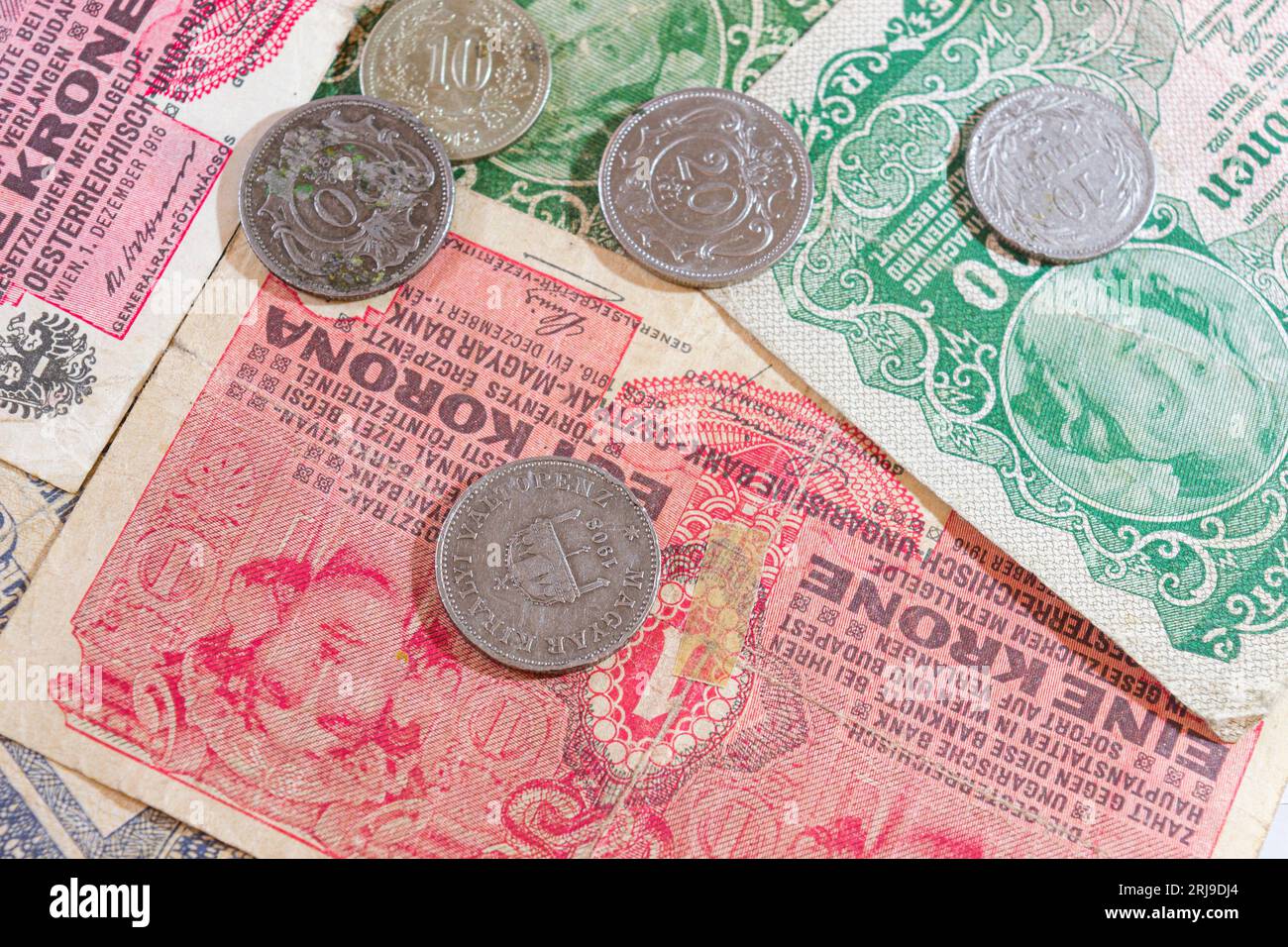 A closeup of Austrian and Hungarian coins from the early 1900s ...