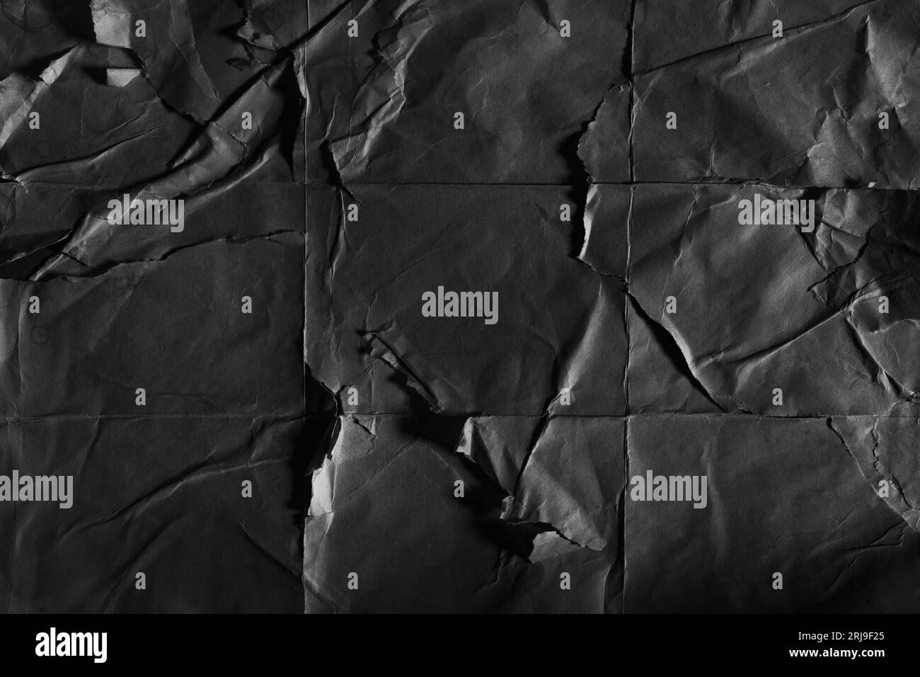 Peeled crumpled black poster paper texture background Stock Photo - Alamy