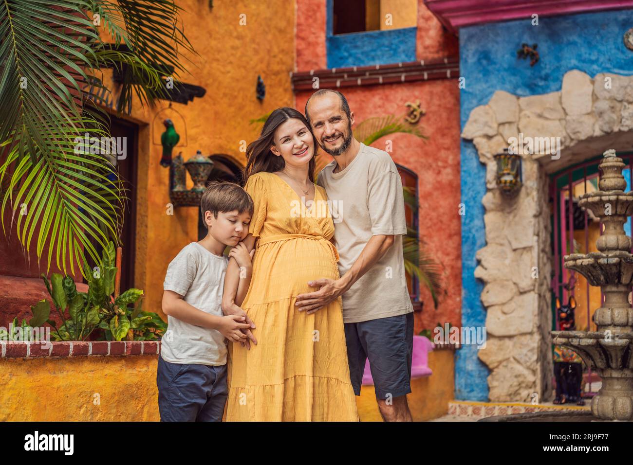 A loving couple in their 40s and their teenage son cherishing the ...