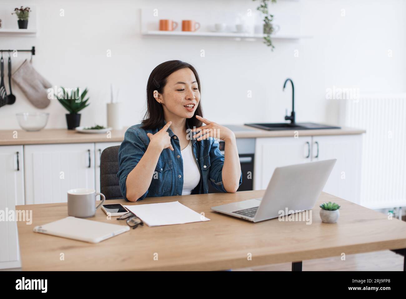 Entrepreneur starting video call via computer in apartment Stock Photo ...