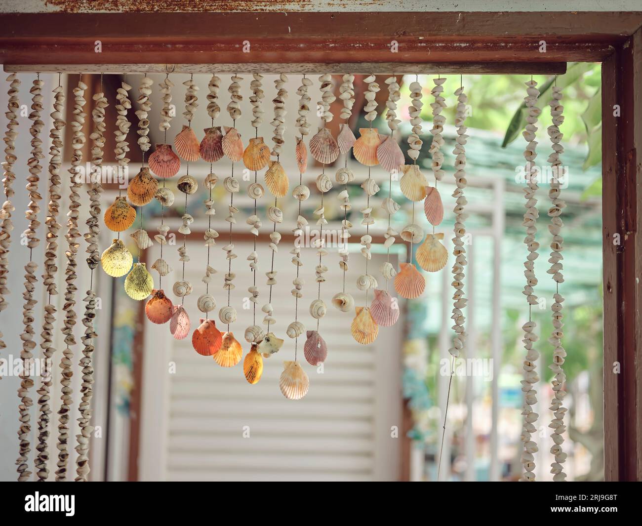The colorful heart shape seashell mobile hanging . CONCEPT LOVE Stock ...