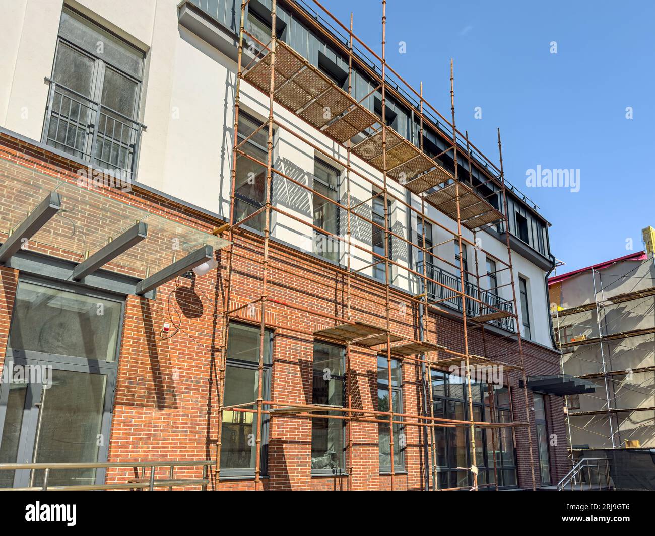 renovation of old building. facade with scaffolding. refurbishment ...