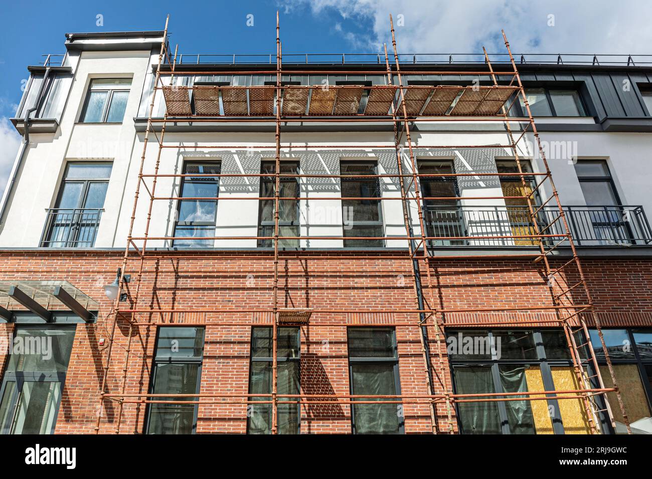 scaffolding near facade of building during renovation works. bottom ...