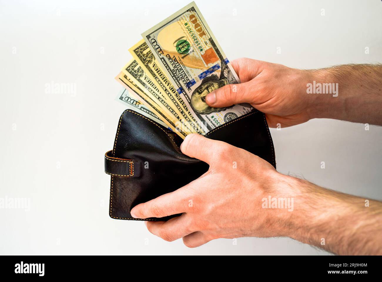 Businessman holding leather wallet hi-res stock photography and images ...