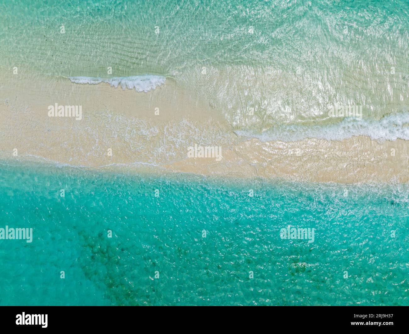 Seascape with clear ocean waves on the sandbar in Camiguin Island ...