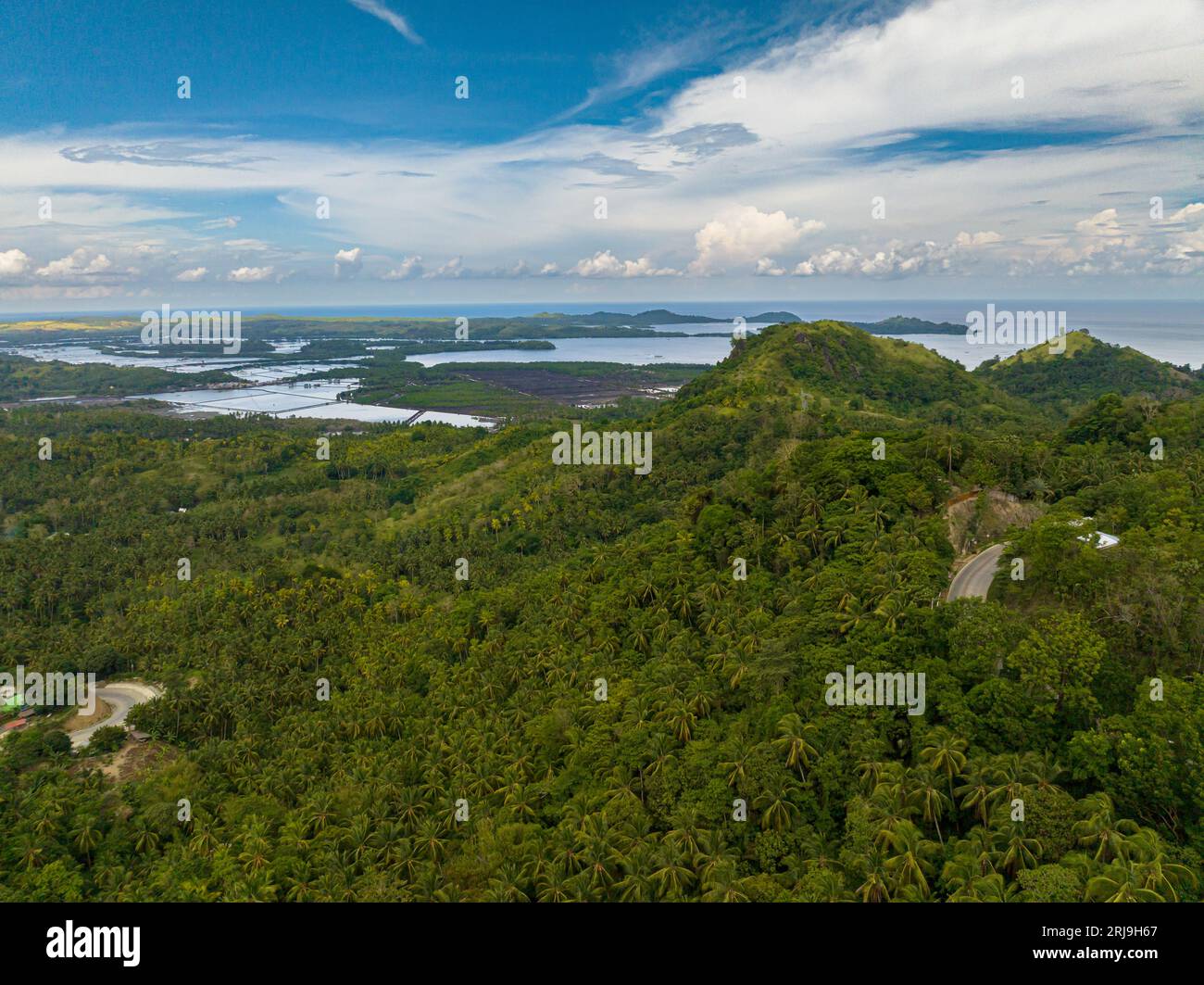 Mountain cliff in coastline in the Philippines. Blue sky and clouds ...